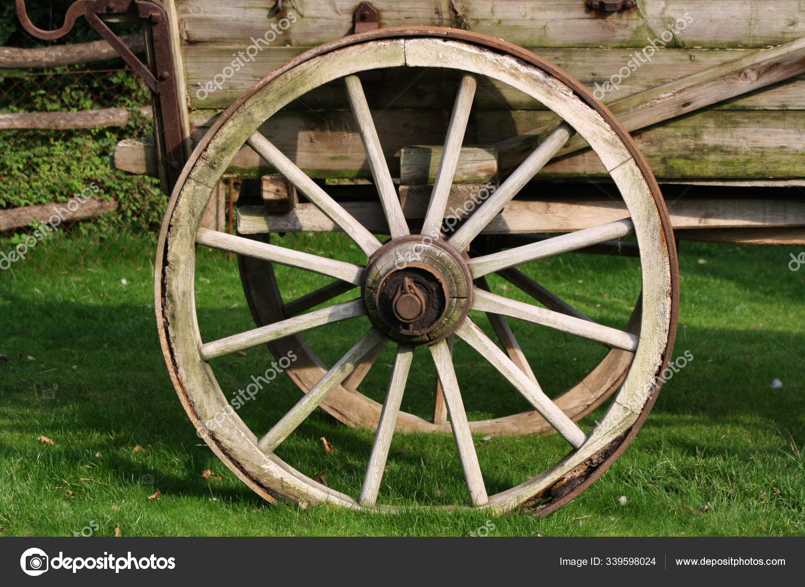 Large Wooden Wagon Wheel Stock Photo by ©PantherMediaSeller 339598024