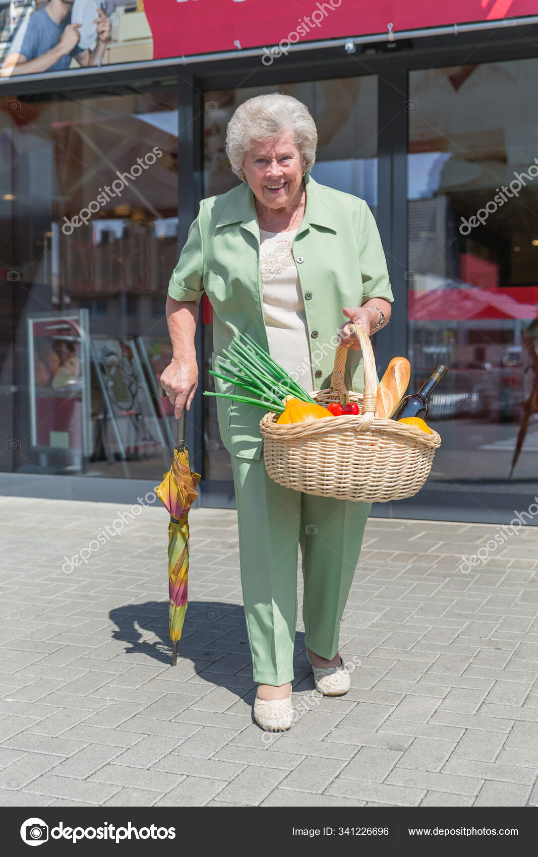Senior Lady Leaving Shopping Center — Stock Photo © PantherMediaSeller ...