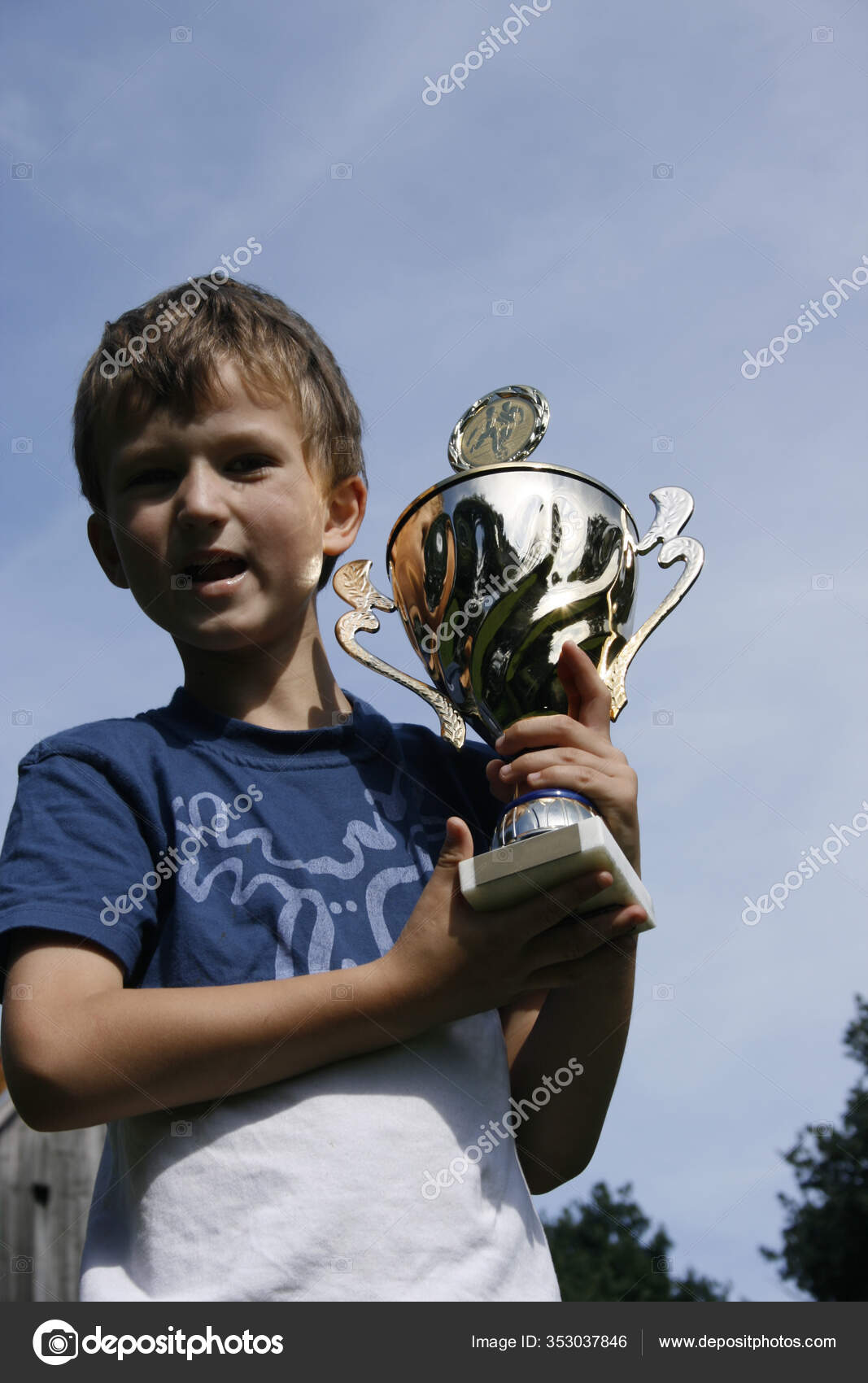 Boy Uniform Holding Trophy — Stock Photo © PantherMediaSeller #353037846
