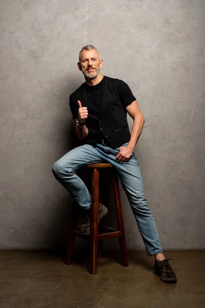 Man sitting on stool Stock Photos, Royalty Free Man sitting on stool ... Man sitting on stool Stock Photos, Royalty Free Man sitting on stool ...