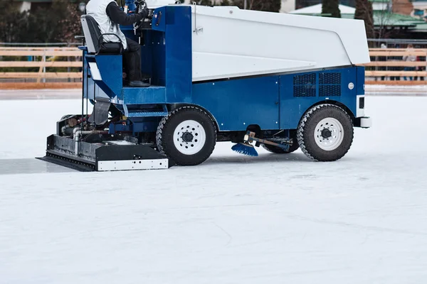 Ice resurfacer to clean and smooth the surface of a sheet of ice rink ...