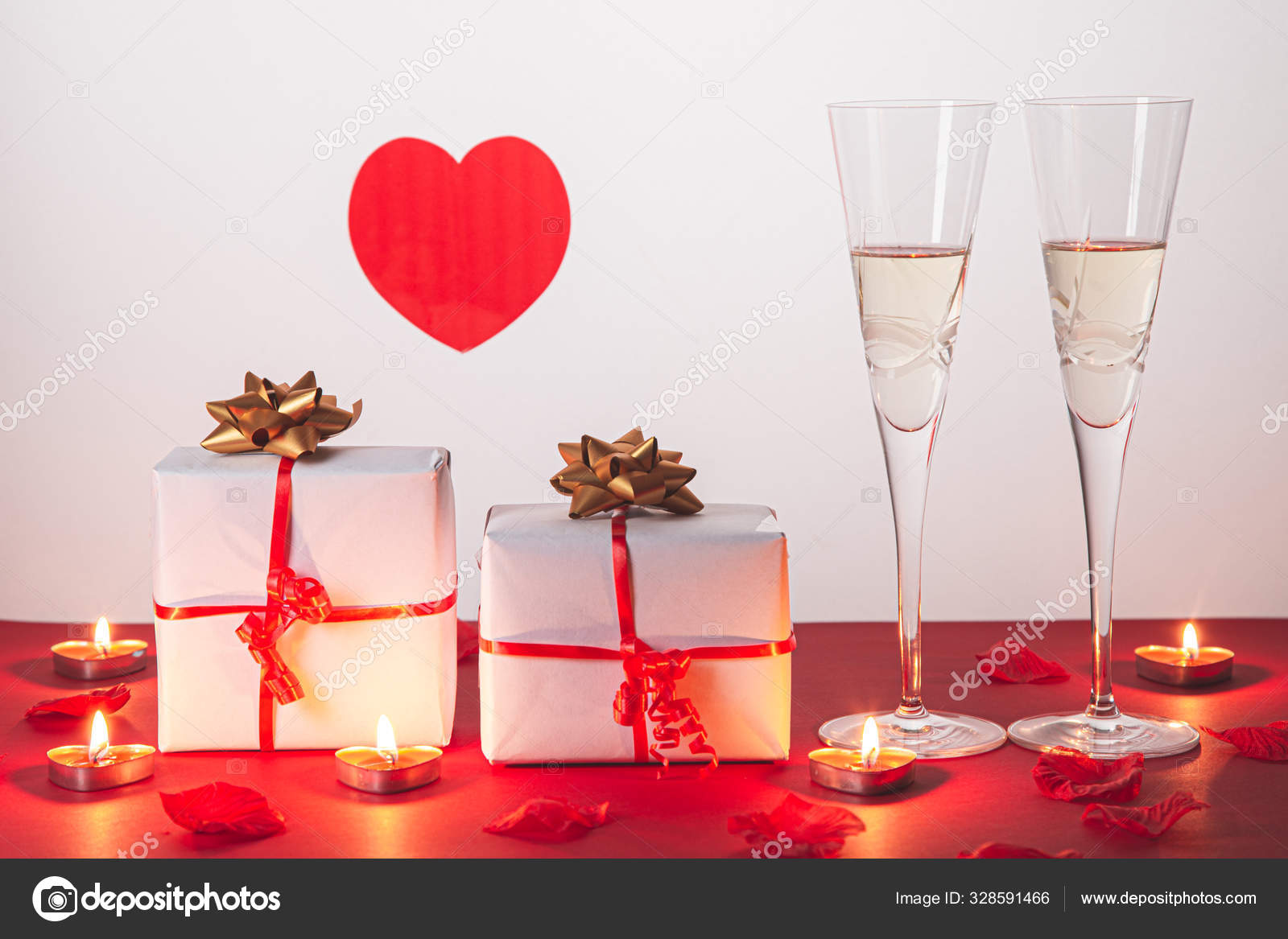Valentines day composition with two glasses of champagne, heart, gifts ...