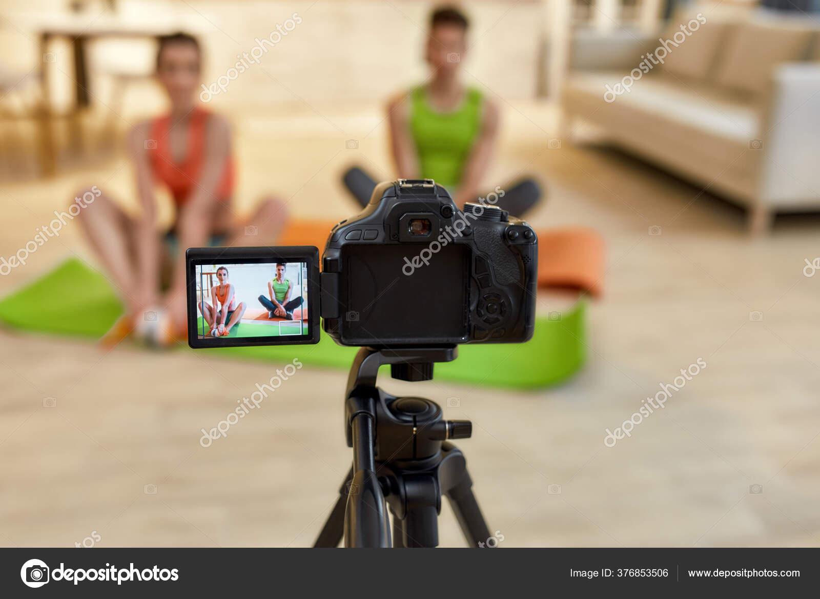 Making stories. Making change. Young couple in sportswear recording ...