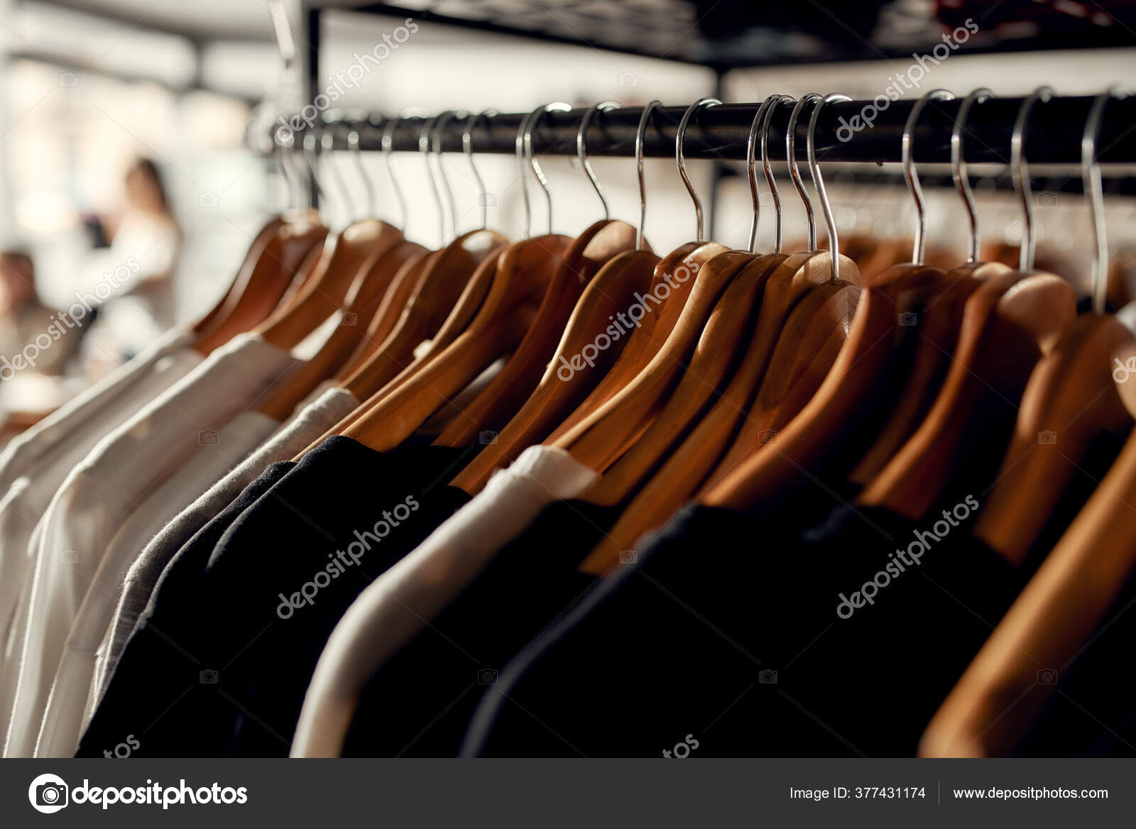 Choice. Close up of clothes rack or rail in the store. Items at custom ...