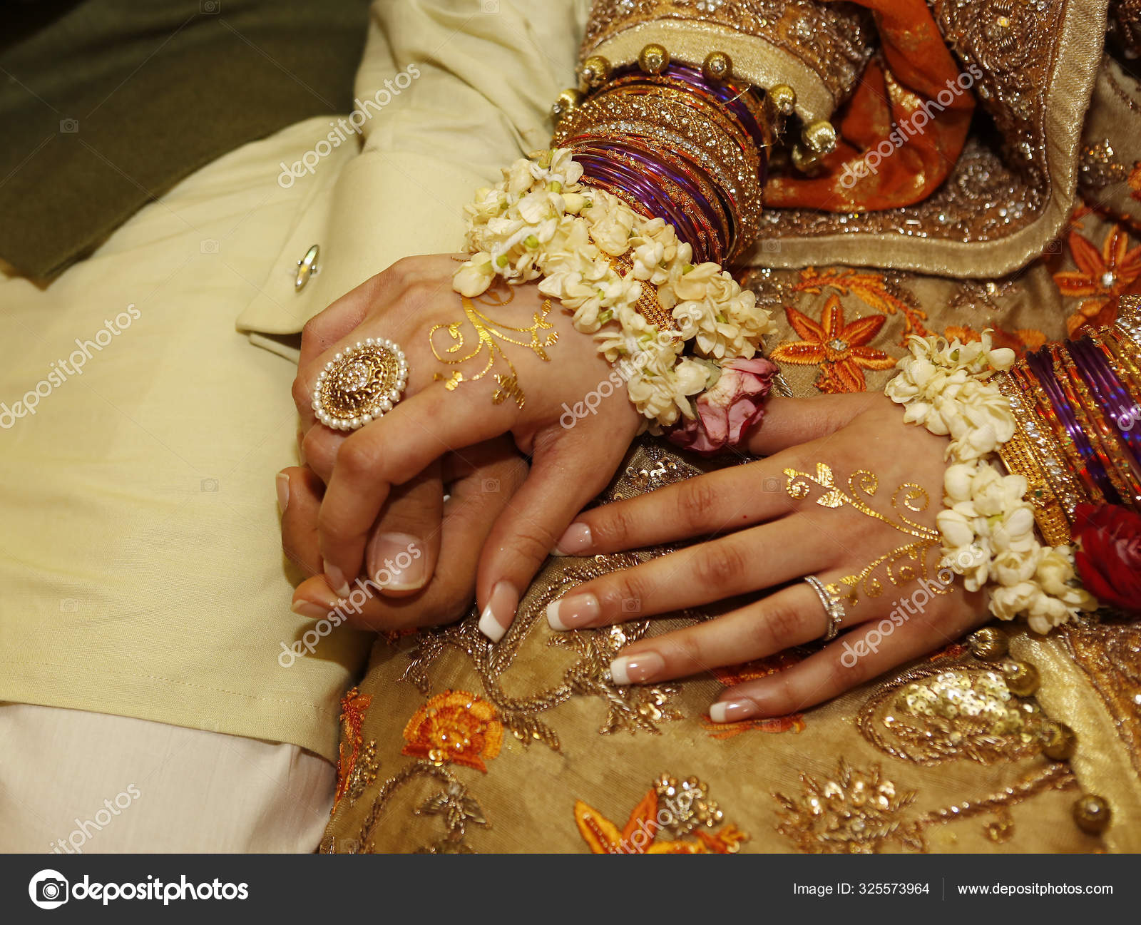 Pakistani Bride And Groom Holding Hands