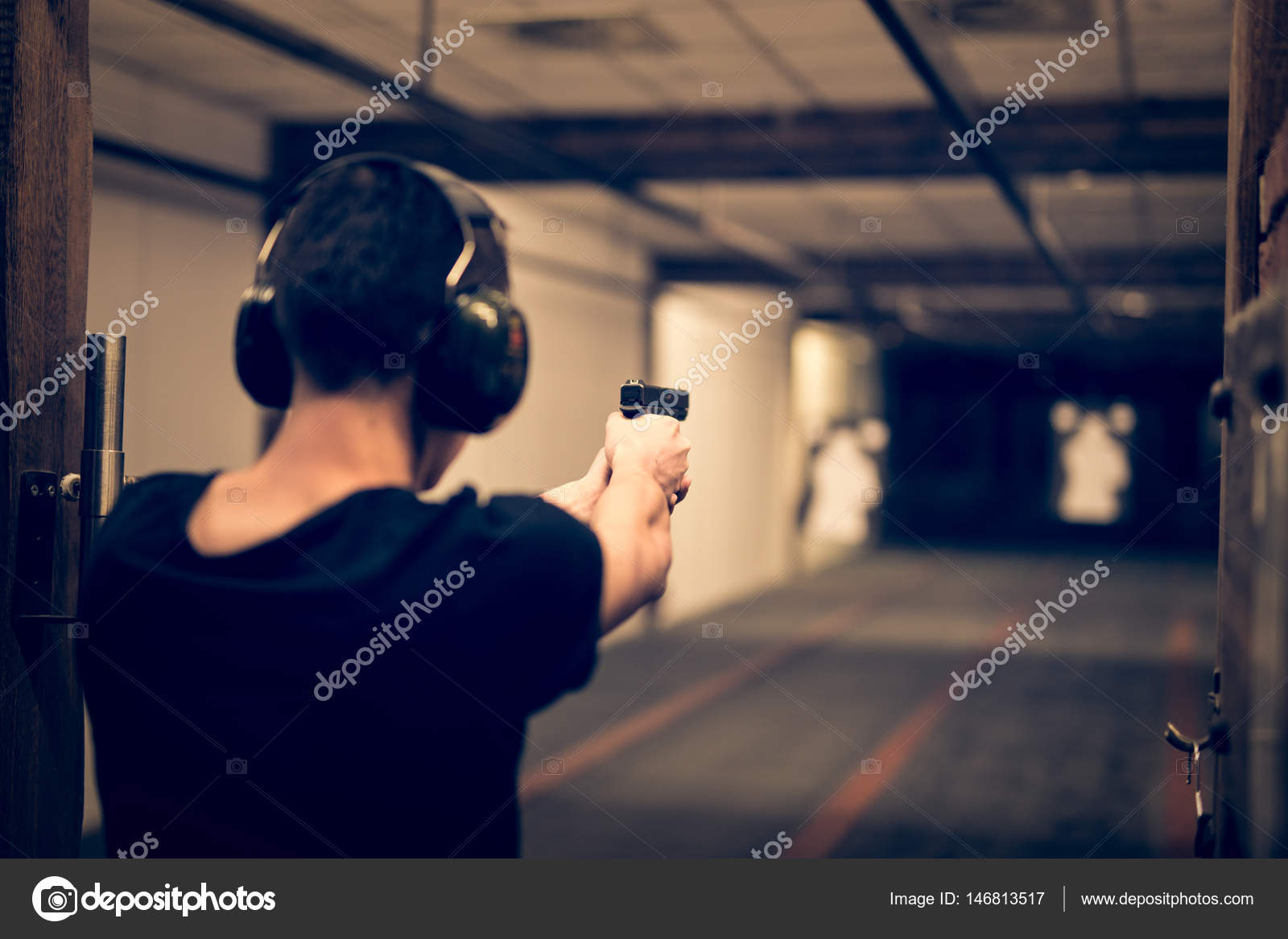 Man shooting in indoor firing range — Stock Photo © guteksk7 #146813517