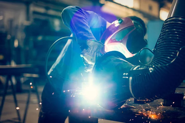 Man using mig mag welder — Stock Photo © guteksk7 #146674839