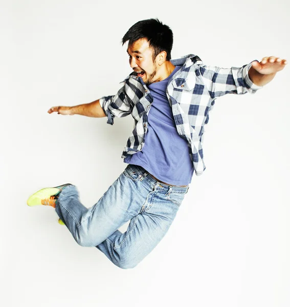 Young pretty asian man jumping Stock Photo by ©iordani 113008320