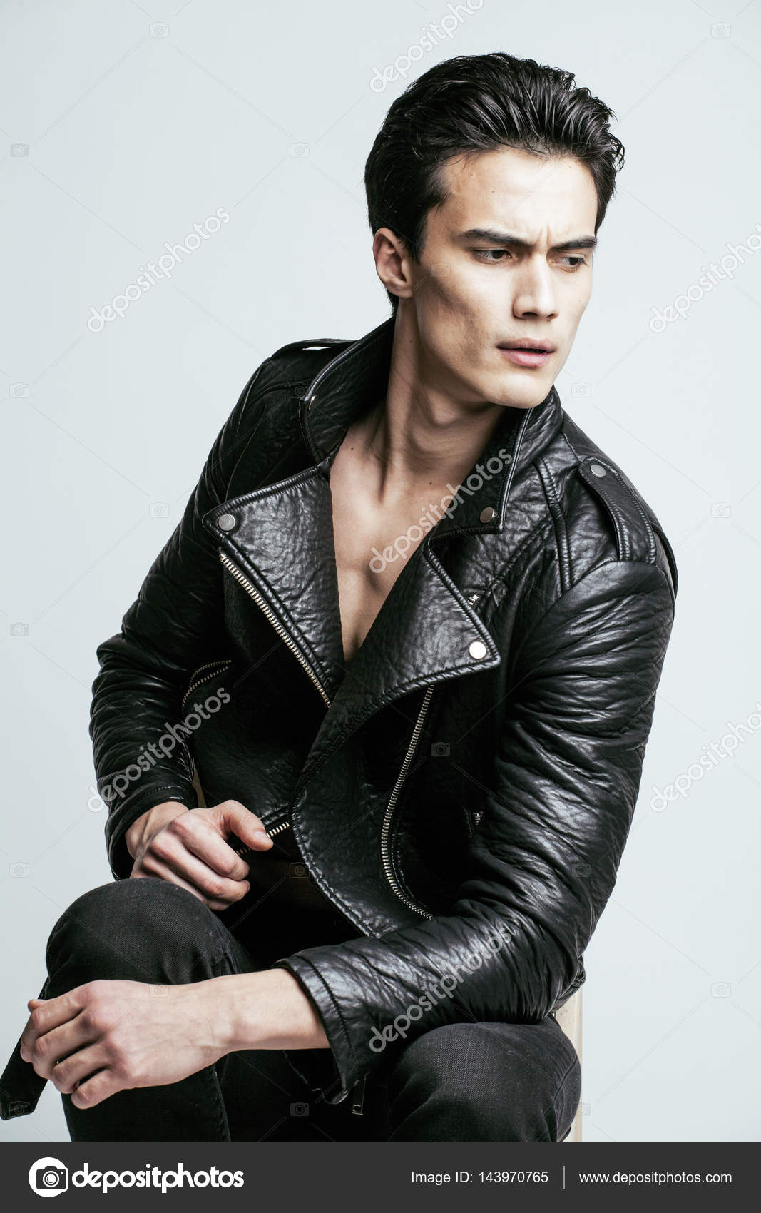 Young handsome man in leather jacket Stock Photo by ©iordani 143970765
