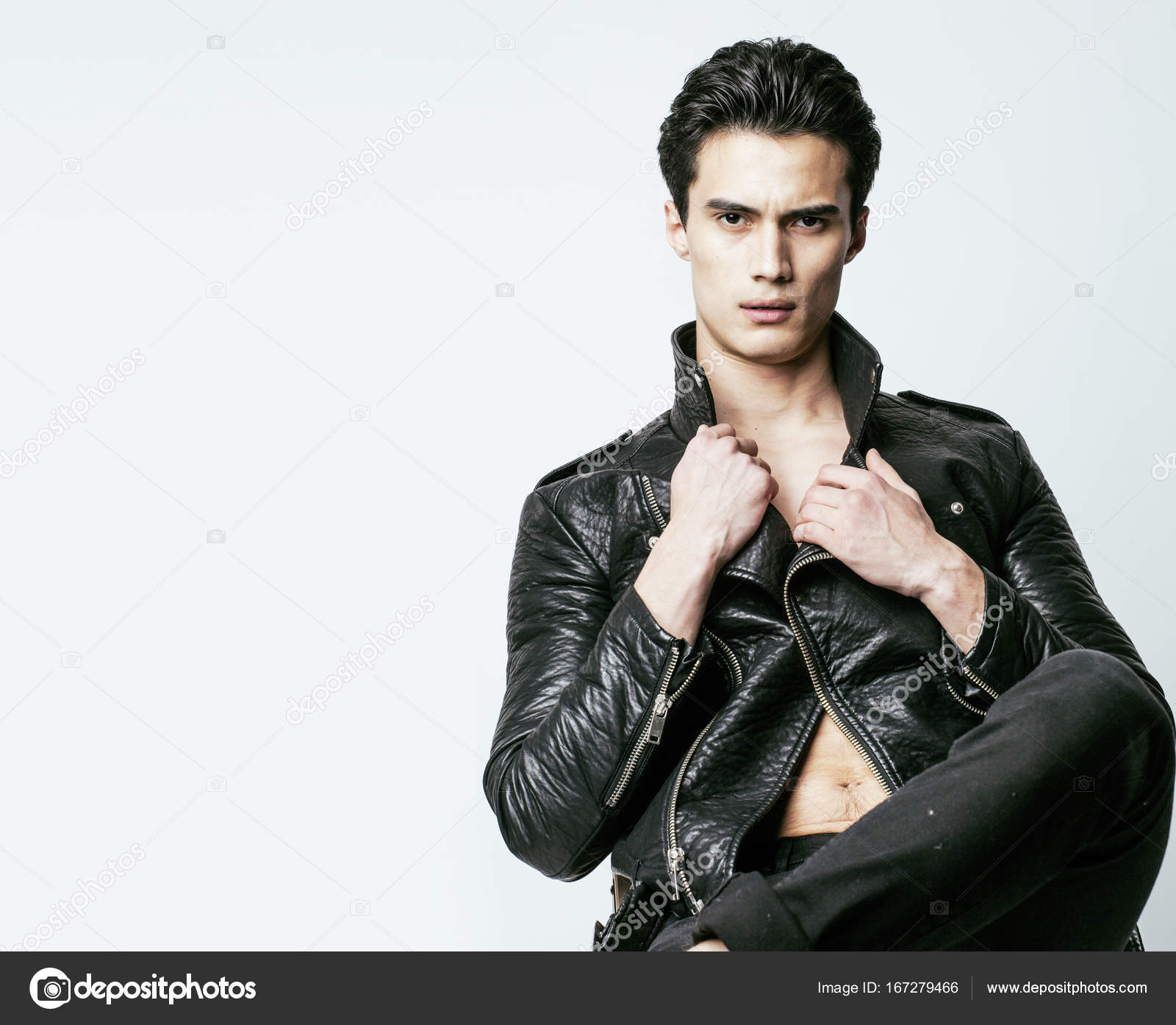 Young handsome man in leather jacket Stock Photo by ©iordani 167279466