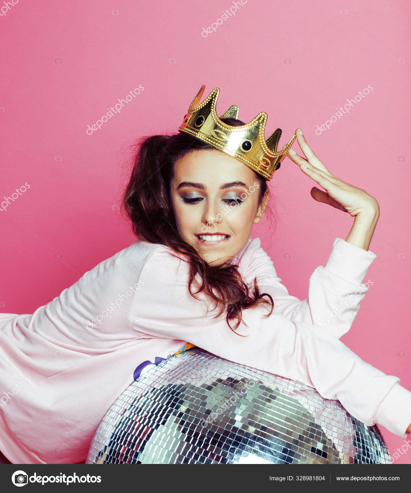 Young cute disco girl on pink background with ball and crown Stock ...