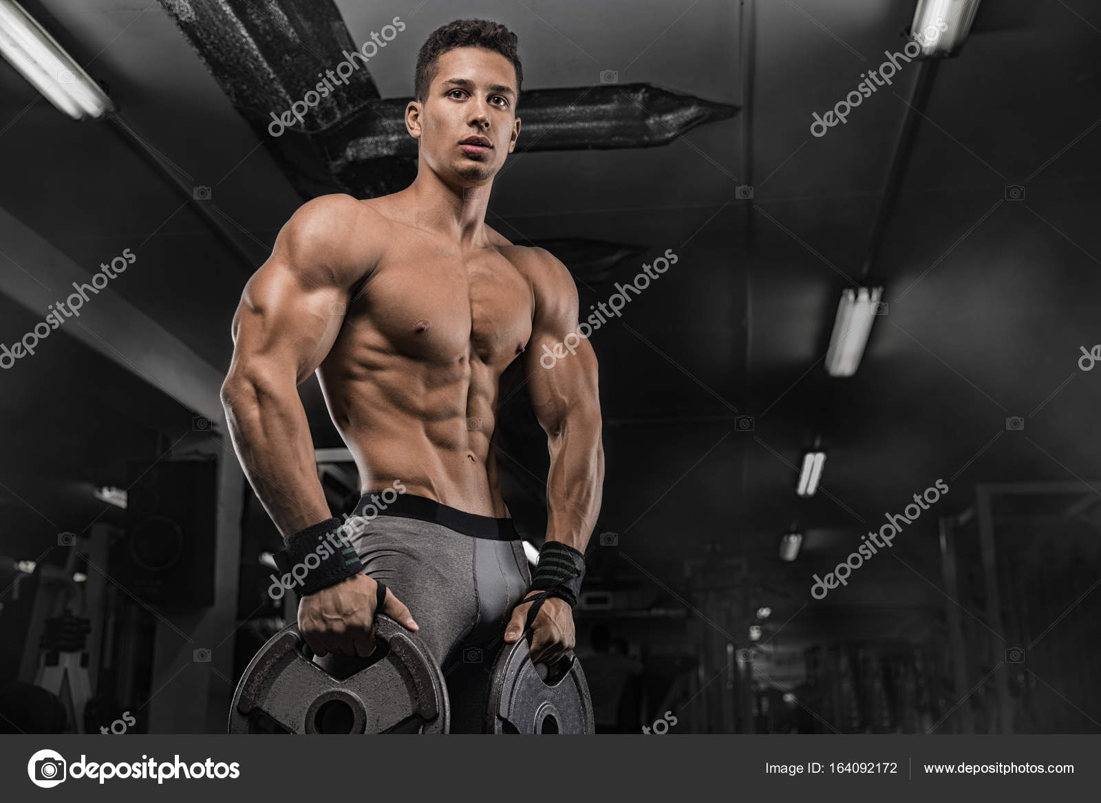 Man Lifting Heavy Weights In The Gym. Athletic sport lifestyle Stock ...