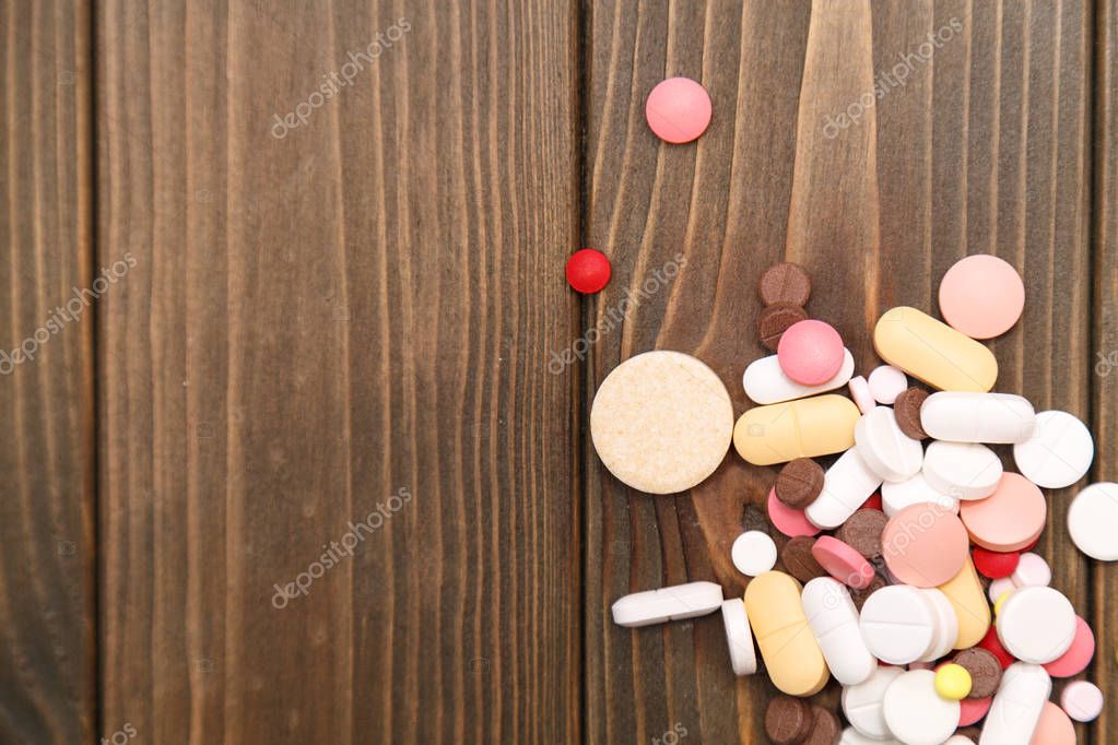 píldoras fondo de madera 2023