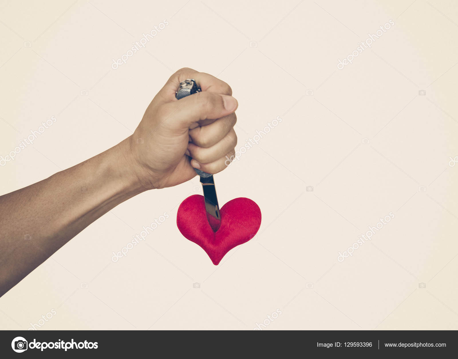 Hand with a knife stabbing into a red heart Stock Photo by ©weerapat ...