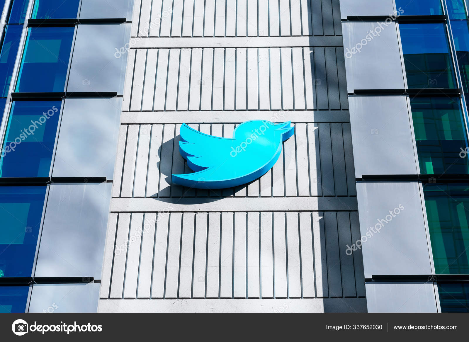 Twitter Bird logo on the headquarters building in downtown. Twitter is ...
