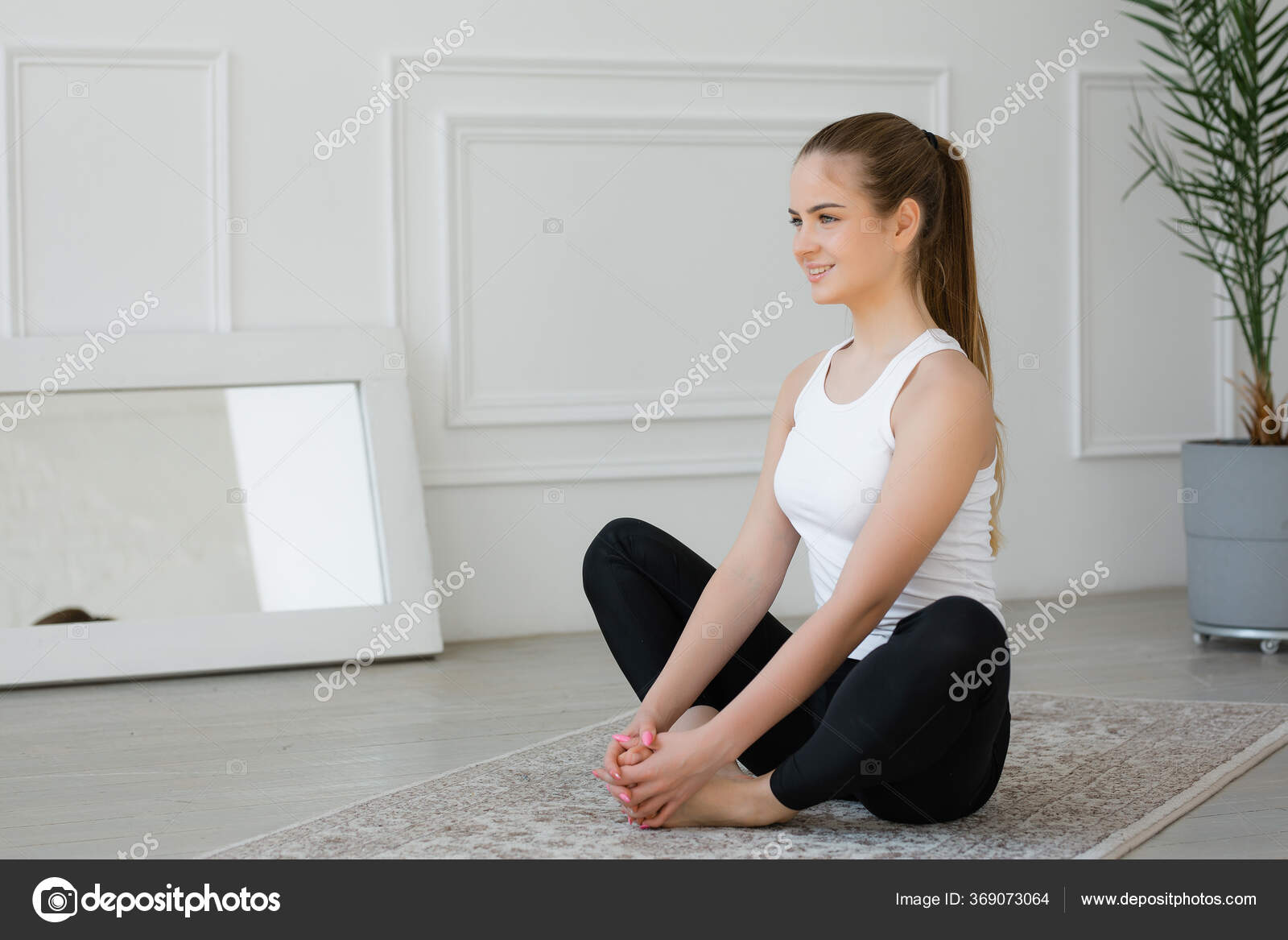 Girl doing butterfly exercise for mobility of the hip joints. Does ...