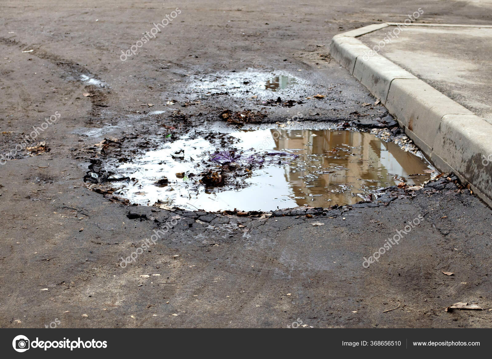 Puddle Pavement Curb Dirt Debris — Stock Photo © OksanaAkhtanina #368656510