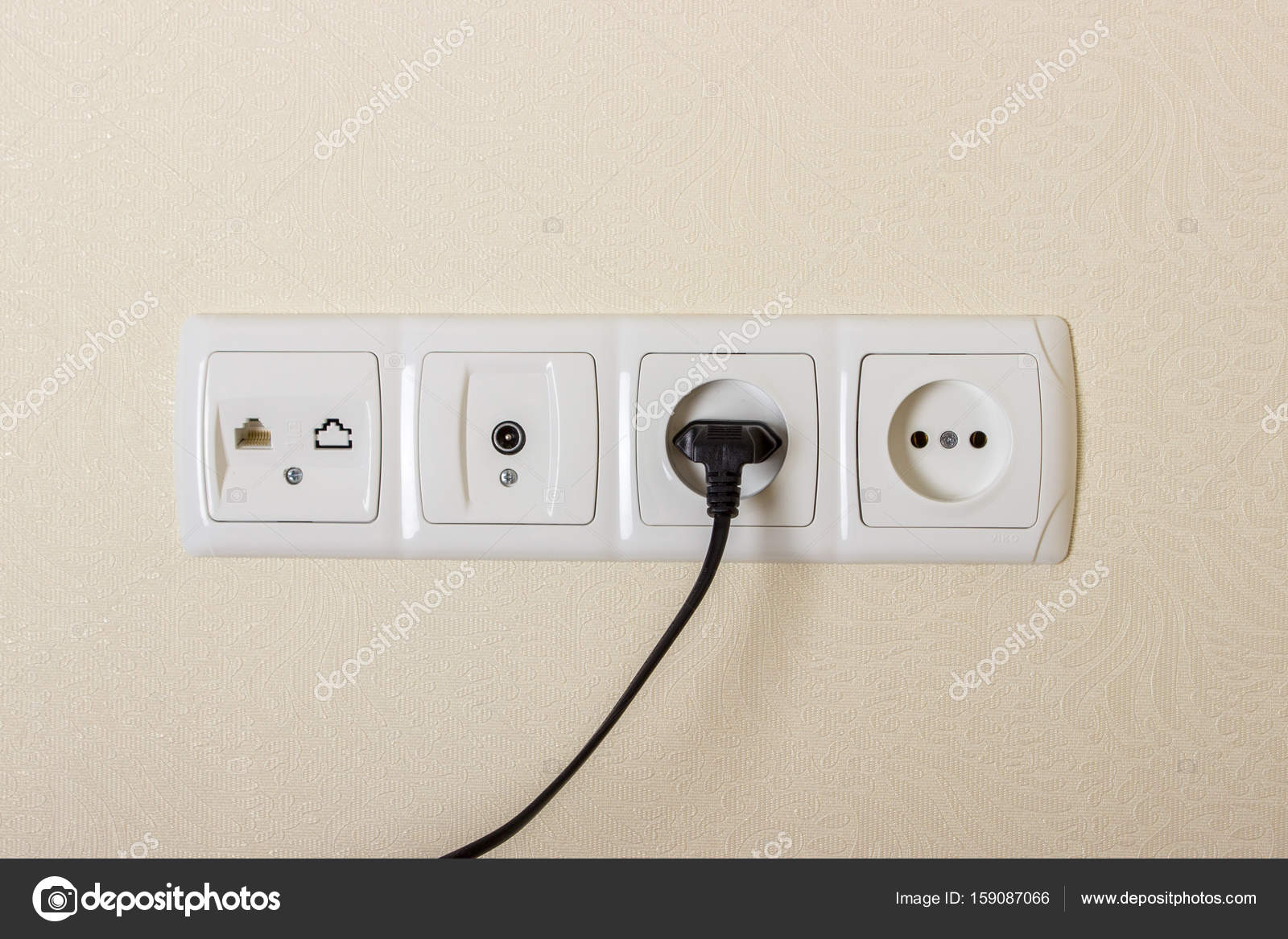 Close up power outlet and telephone outlet and computer outlet in a ...