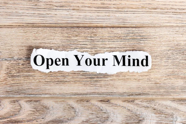 OPEN YOUR MIND text on paper. Word OPEN YOUR MIND on torn paper ...
