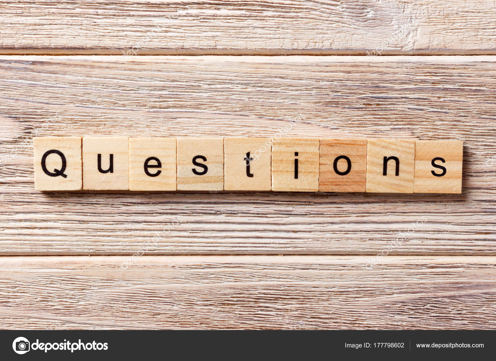 Questions word written on wood block. Questions text on table, concept ...