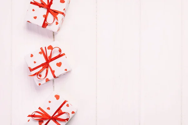 Valentine or other holiday handmade present in paper with red hearts ...