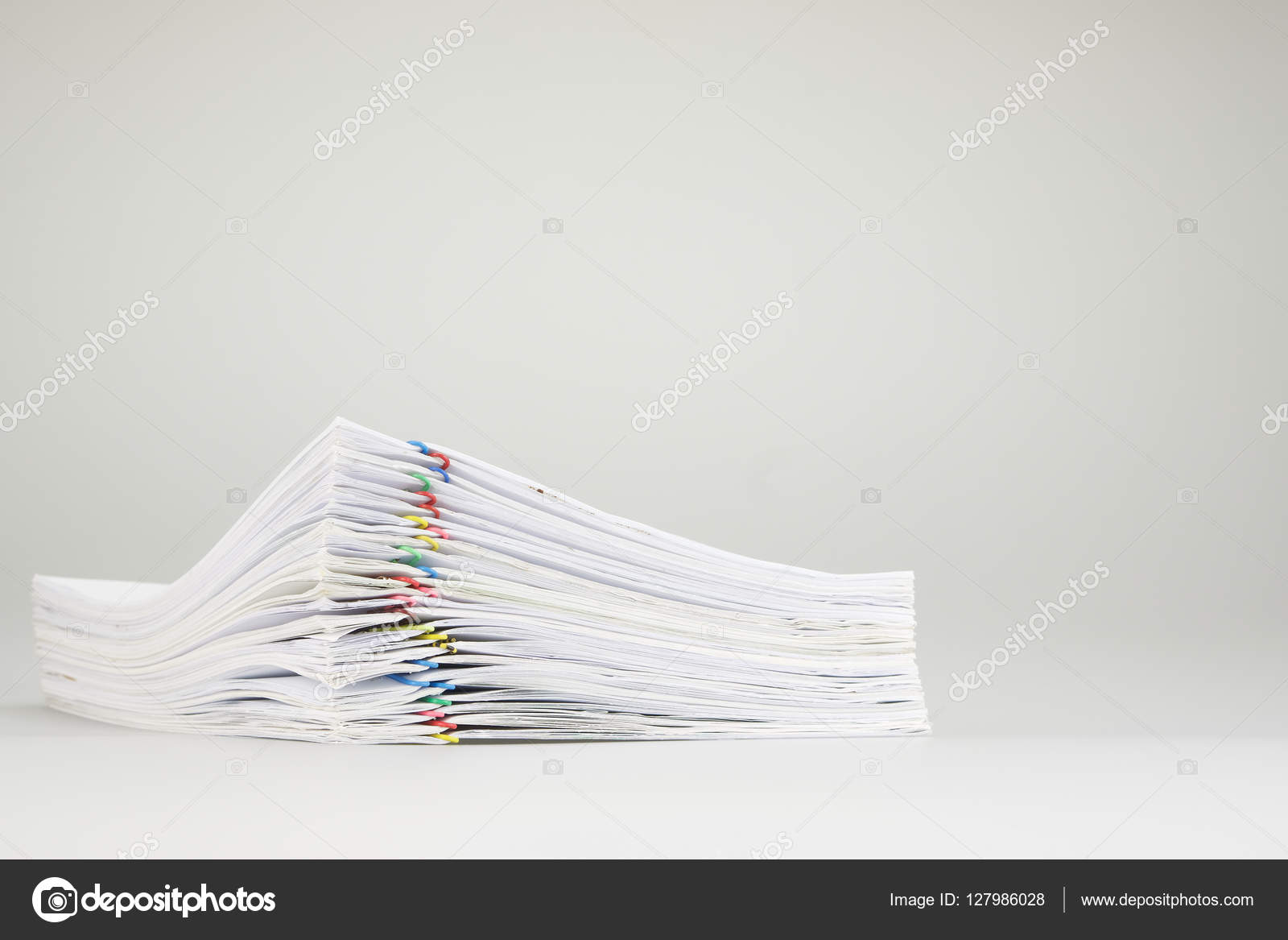 Pile overload of paper place on white background Stock Photo by ...