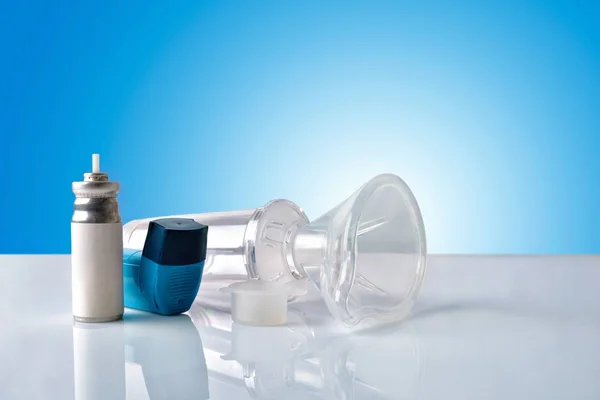 Cartridge inhaler and chamber and mask in room front view Stock Photo ...