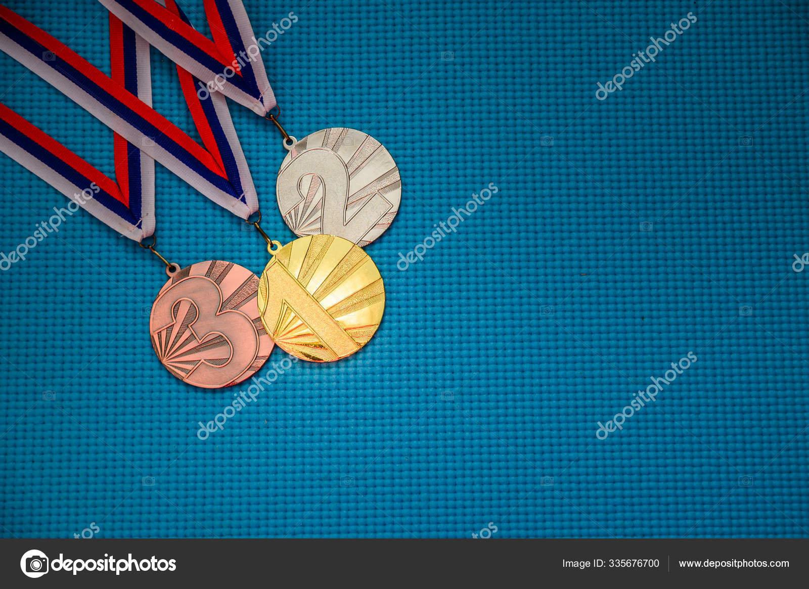 Medal set on blue background. Gold silver and bronze, blue edit space ...