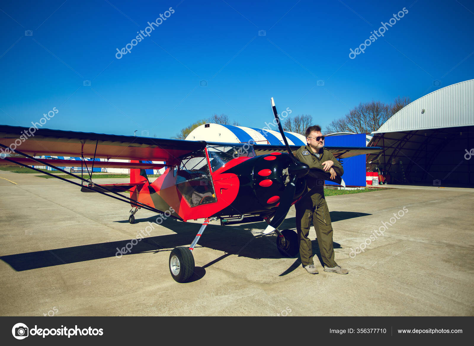 Pilot Repairs Small Aircraft Man Flight Suit Ultralight Plane Aerodrome ...