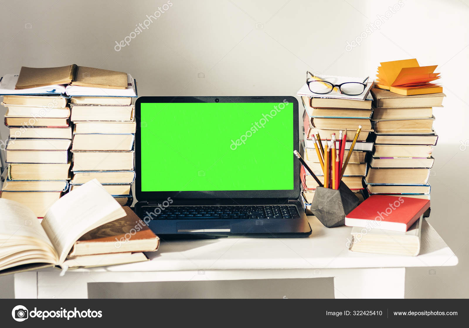 Green screen laptop, stack of books, notebook and pencils on whi Stock ...
