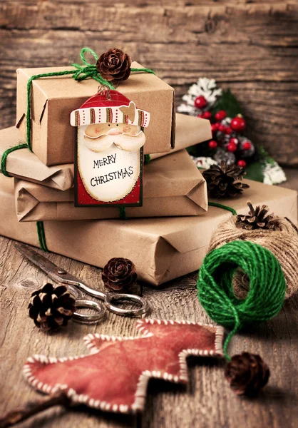 wrapping Christmas presents in rustic style - Stock Image - Everypixel