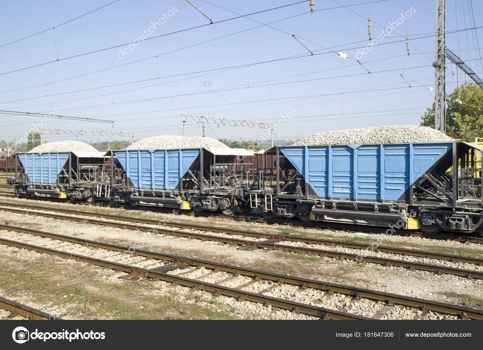 Three freight wagons with gravel on the siding Stock Photo by ...