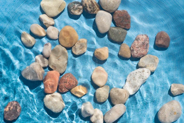 Pebble stones in water Stock Photo by ©aga77ta 162428146