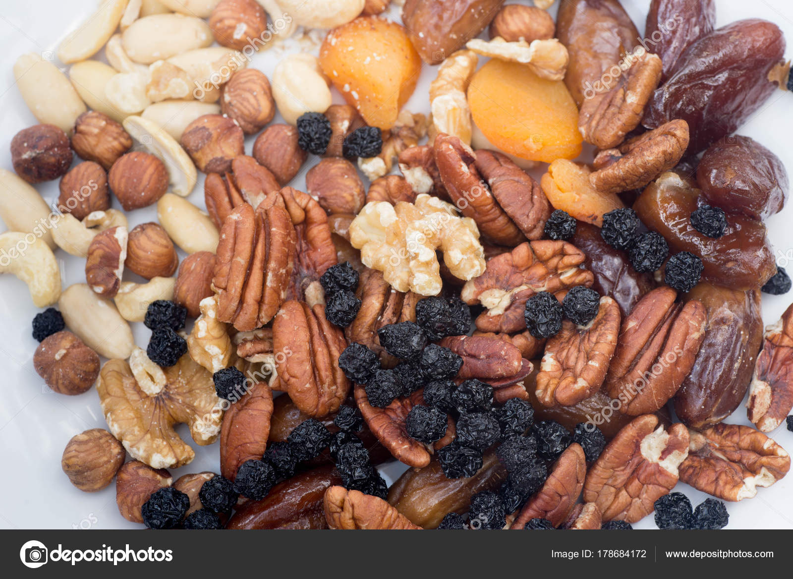 Mixed dried fruits and nuts Stock Photo by ©aga77ta 178684172