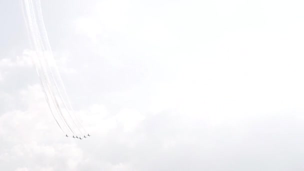 Five fighter jets in the blue sky. White color. A general plan ...