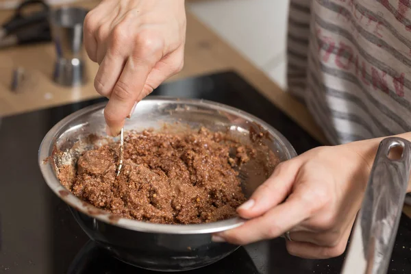 Woman's hands mixing chocolate mixture - Stock Image - Everypixel