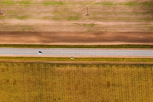 Panorama aerial view shot on road in the fields.Top View of Rural Road ...