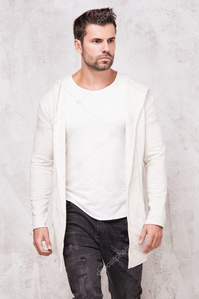 Handsome young man posing. Stock Photo by ©NeonShot 127431658