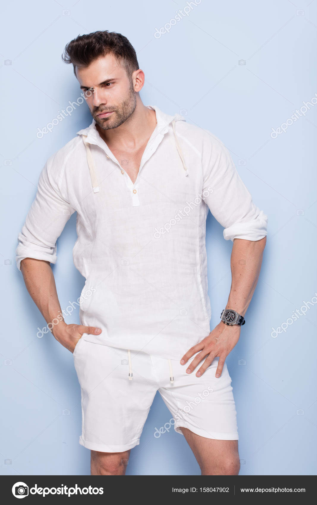 Handsome man posing in studio. Stock Photo by ©NeonShot 158047902