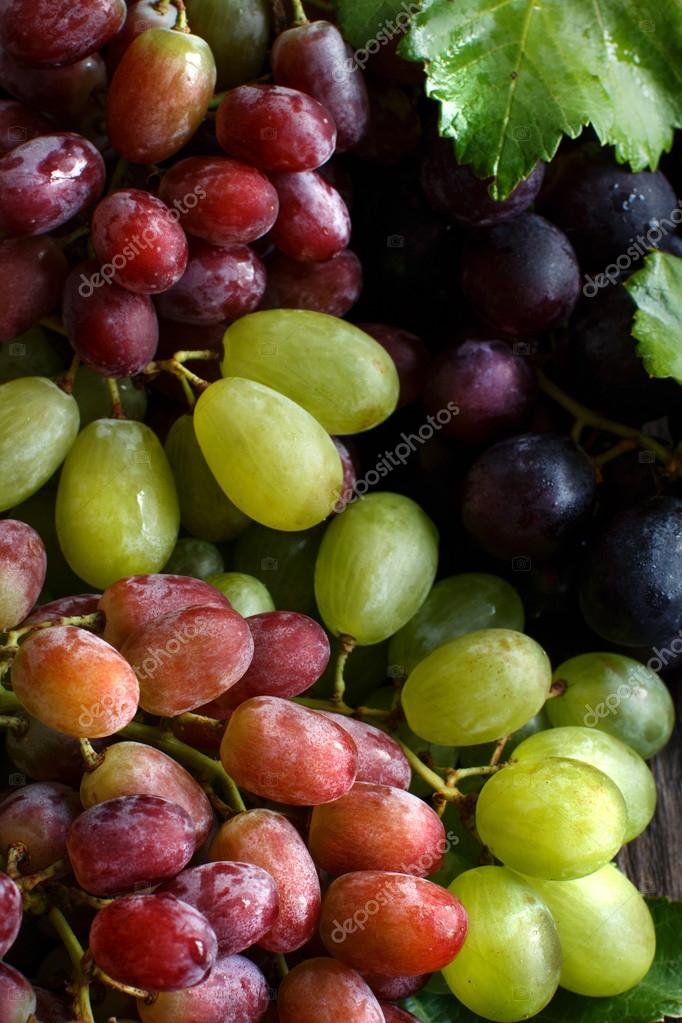 Three types of grapes on a wooden Background Stock Photo by ©karissaa ...
