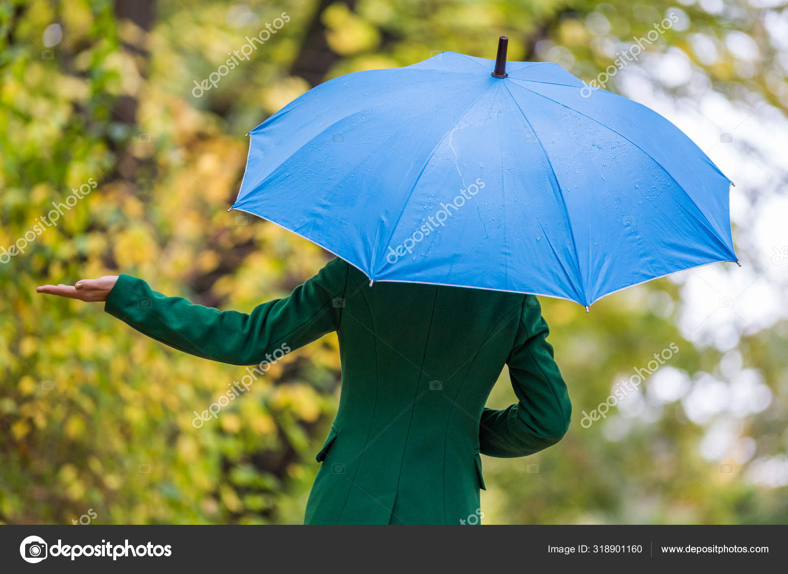 Woman Holding Blue Umbrella Checking Rain While Standing Park — Stock ...