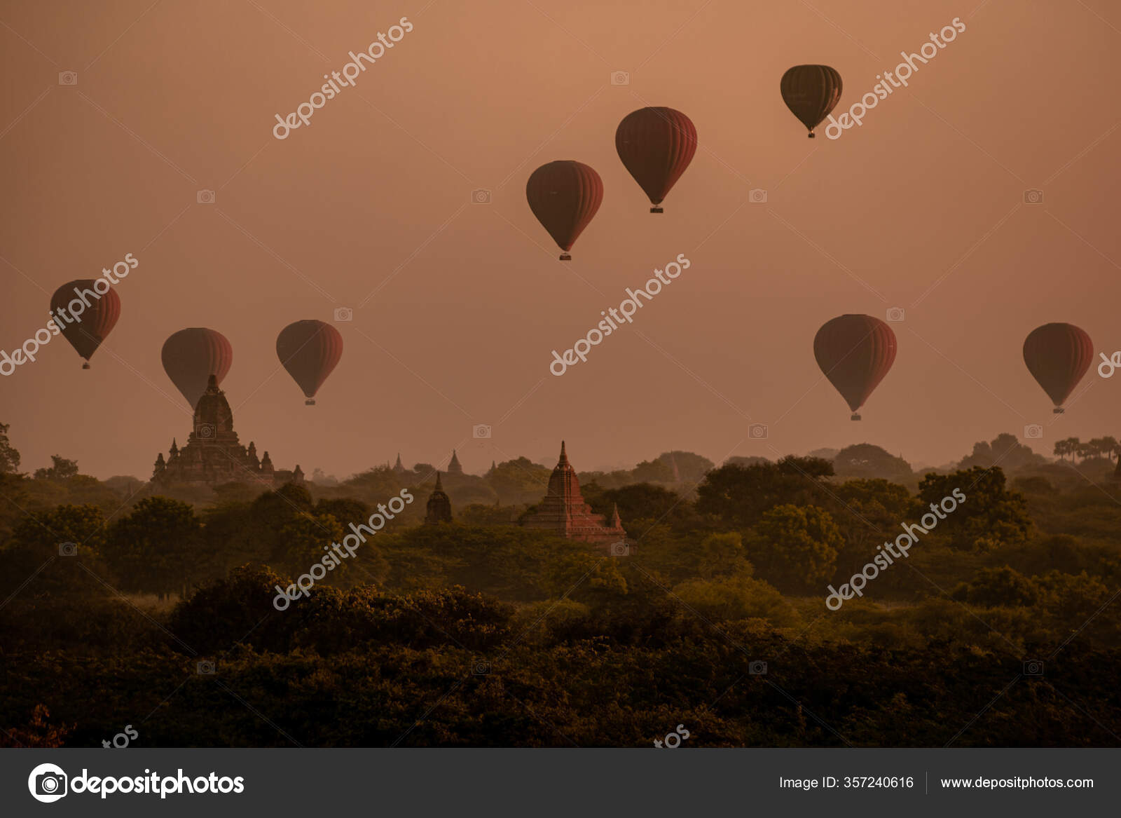 Bagan Myanmar, hot air balloon during Sunrise above temples and pagodas ...