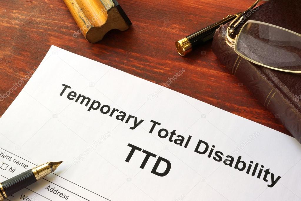 Temporary Total Disability (TTD) form on a wooden table. — Stock Photo ...