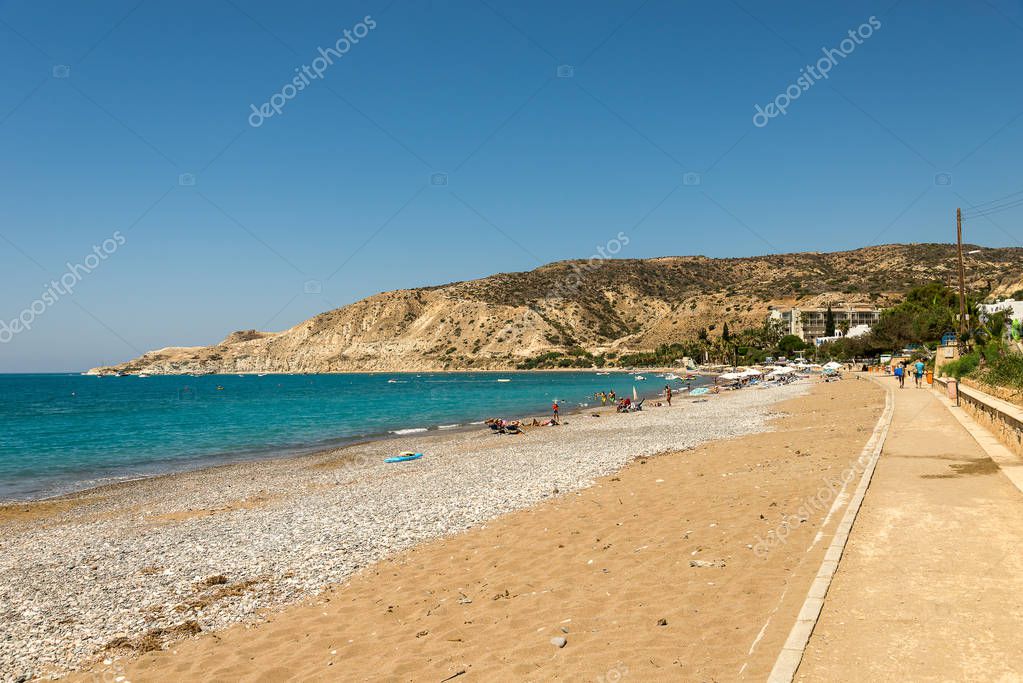 Pissouri, Cyprus, July 2017: Pissouri Bay beach with tourists relaxing ...