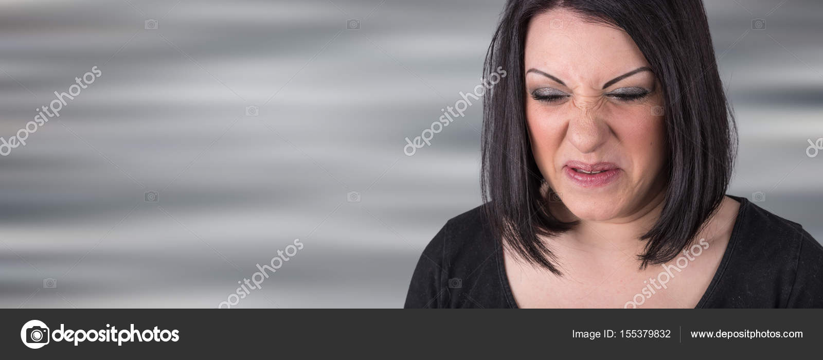 Young woman with an expression of disgust — Stock Photo © thodonal ...