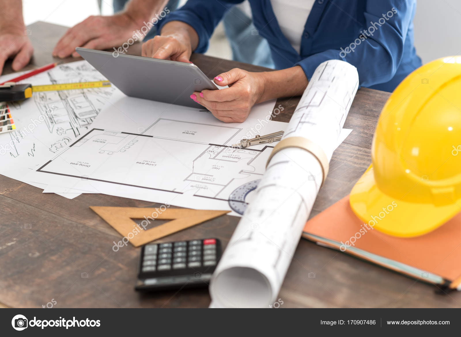 Architects working on plans Stock Photo by ©thodonal 170907486