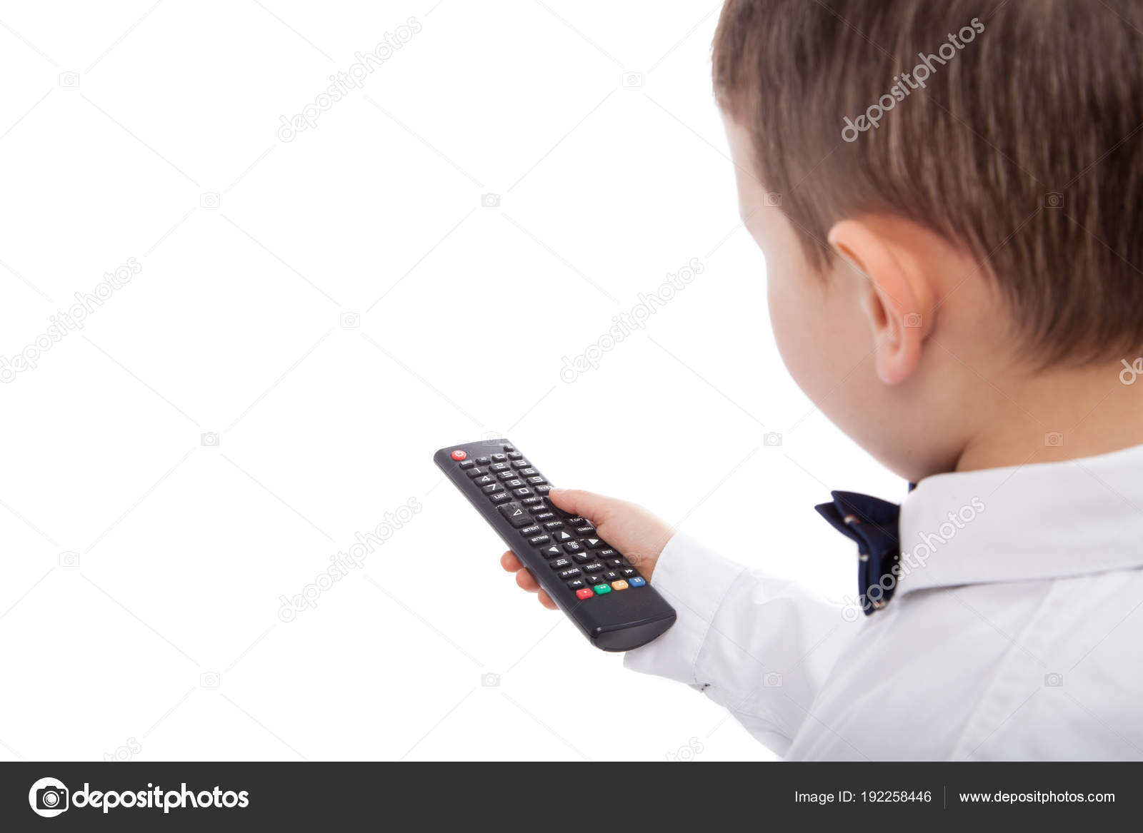 Little boy changing channels on TV using remote control, isolated on ...
