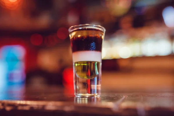 A cocktail made by layers. Shot at the bar. — Stock Photo © airkost ...