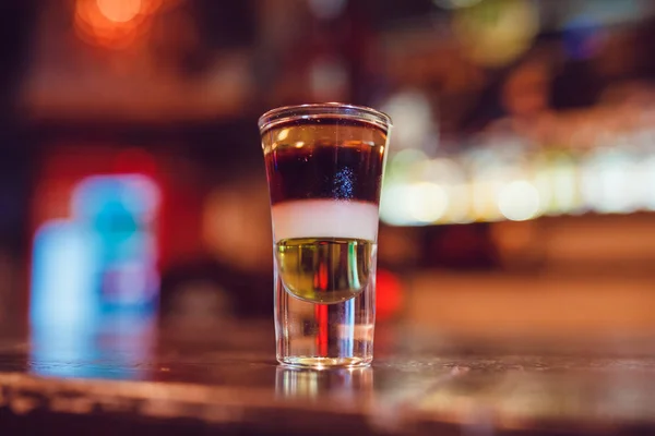 A cocktail made by layers. Shot at the bar. — Stock Photo © airkost ...