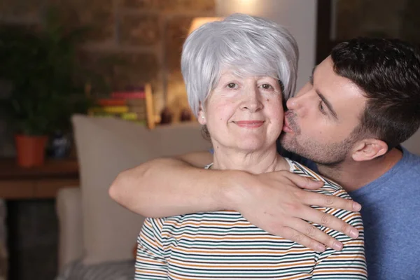 Portrait of Elderly Man Standing near the Window with His Young Blonde ...